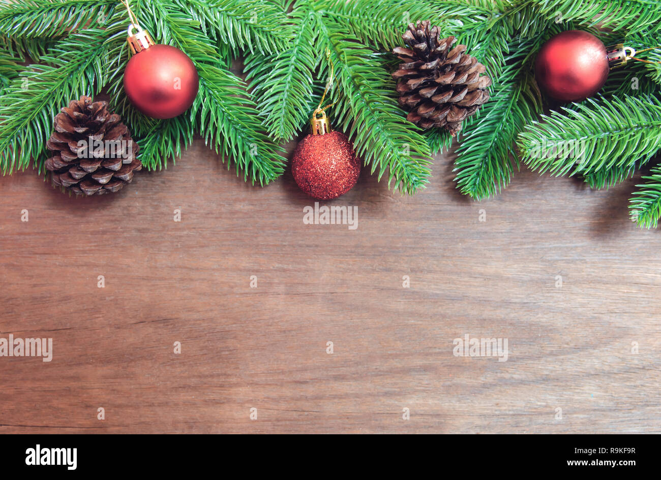 Christmas background. Fir tree branches, red Christmas ball and pine ...