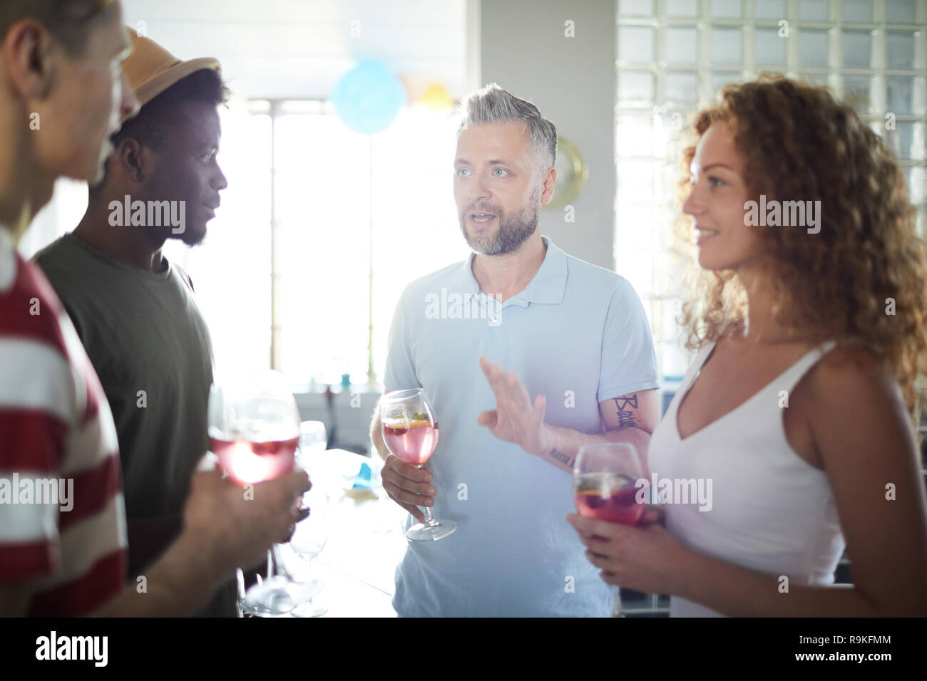 Talking at party Stock Photo - Alamy