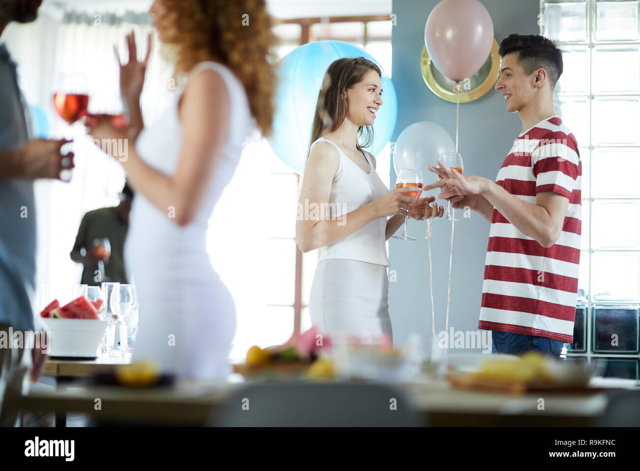 Talking at party Stock Photo - Alamy