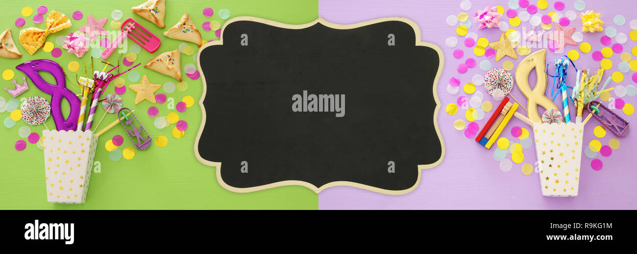 Purim celebration concept (jewish carnival holiday) over purple, pink ...