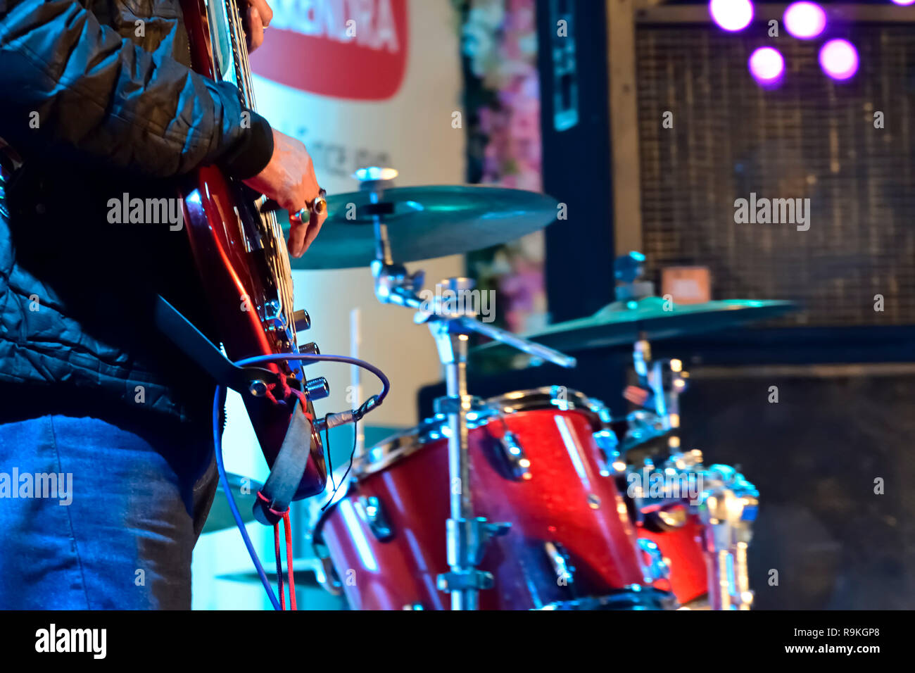 Close-up of artist playing guitar in live concert on stage Stock Photo ...