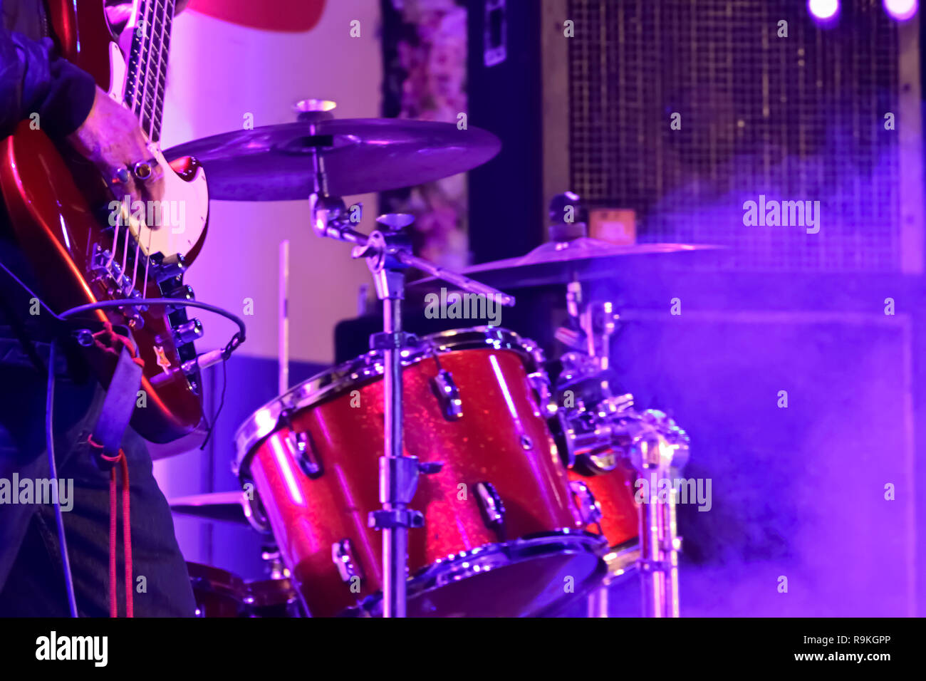 Close-up of artist playing guitar in live concert on stage Stock Photo ...