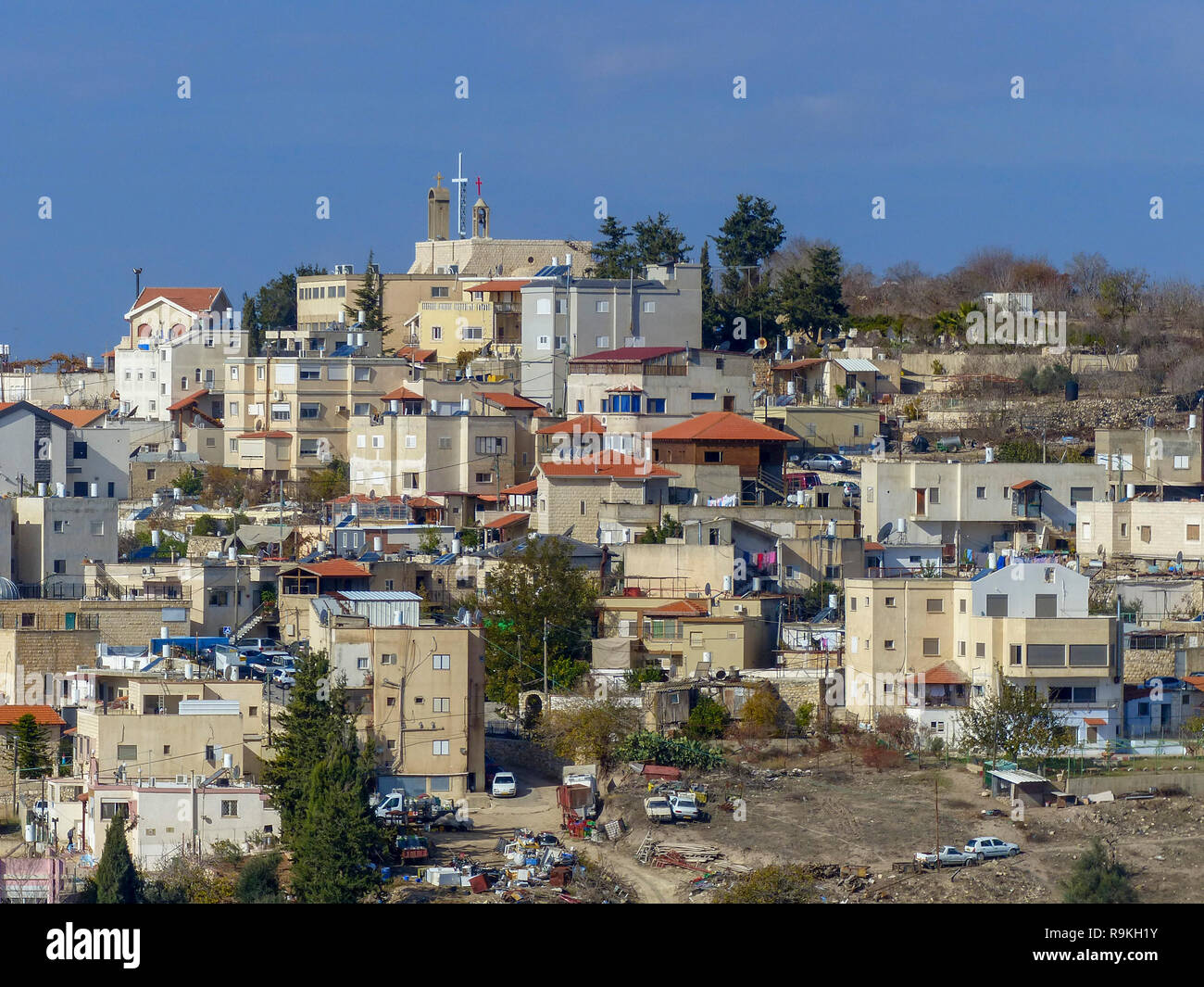Israel, Galilee. Aerial view of an Arab village built on a mountain ...