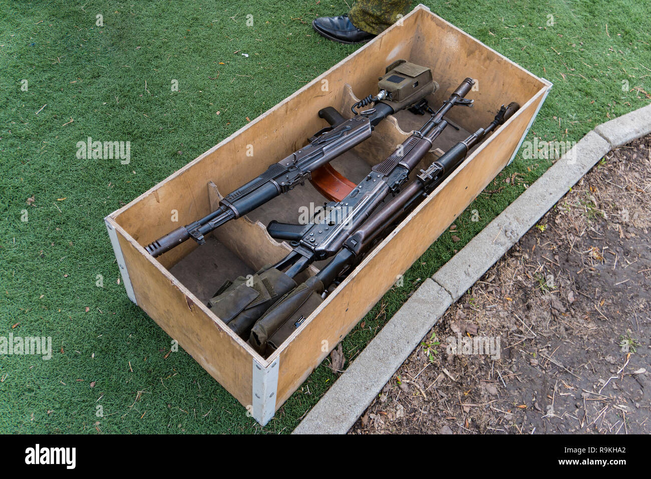 Kalashnikov assault rifles in a wooden box. Arms trade. illegal sale of ...