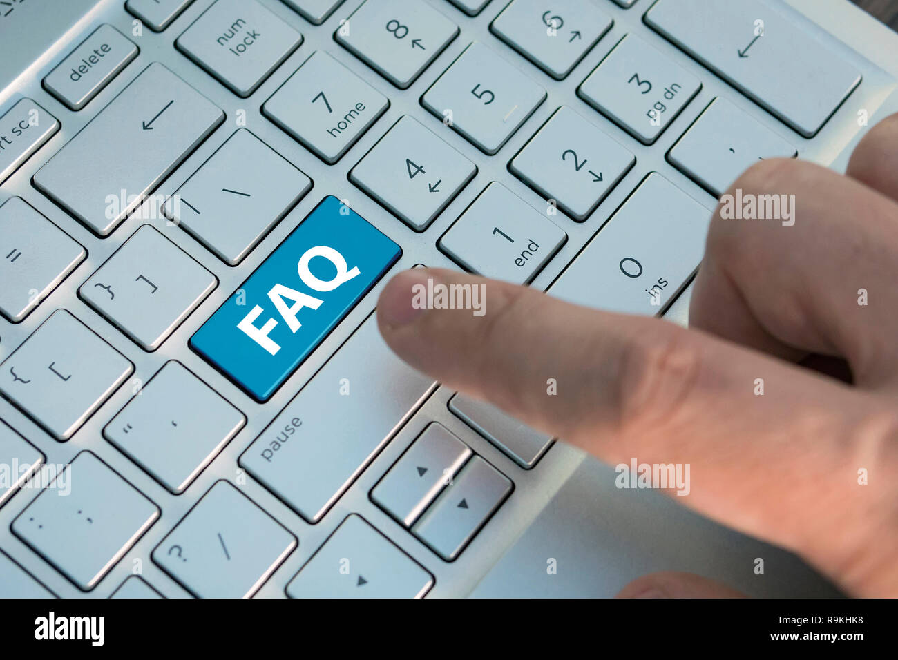 Computer notebook keyboard with FAQ key - technology background Stock ...