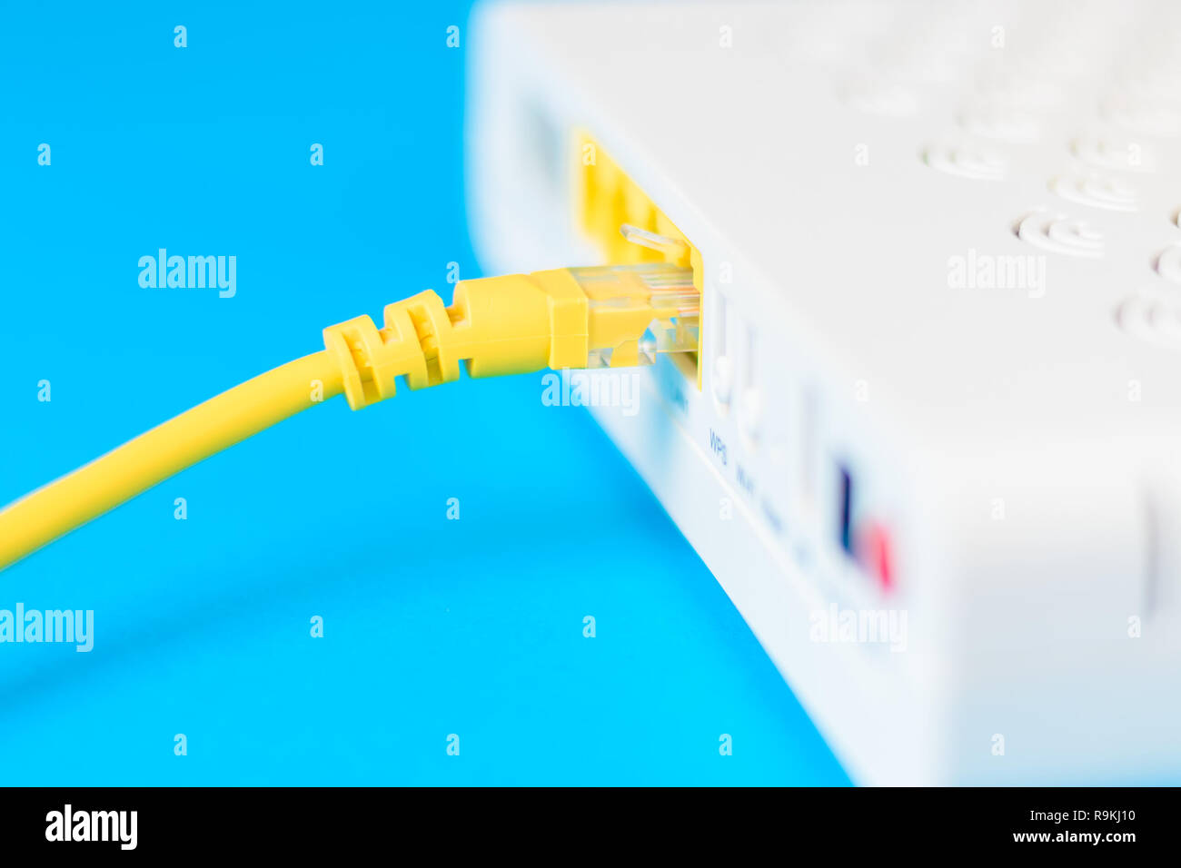 internet modem router hub with cable connecting on blue background ...