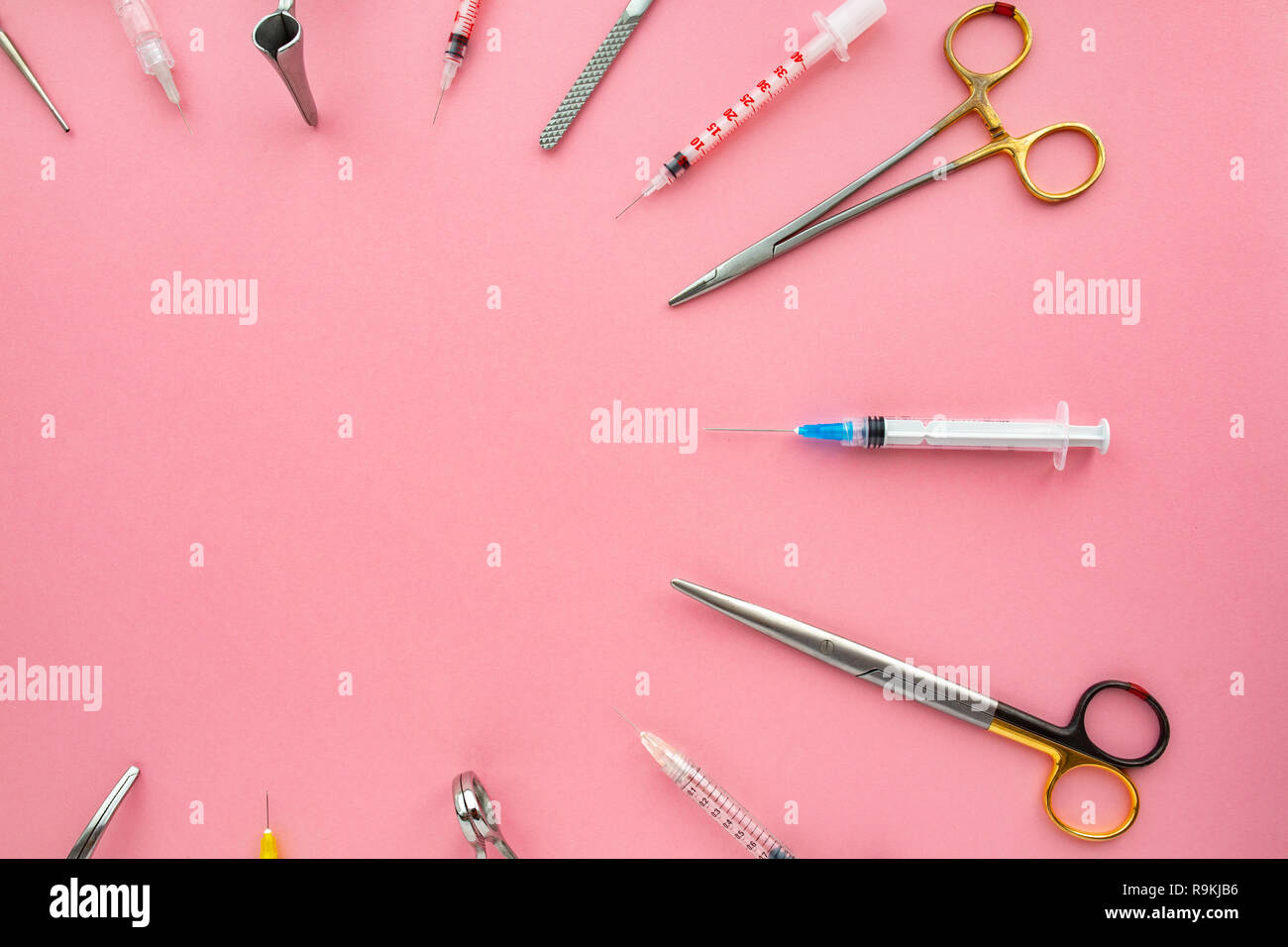 Flat lay of medical instruments on rose background. Mock up health care ...