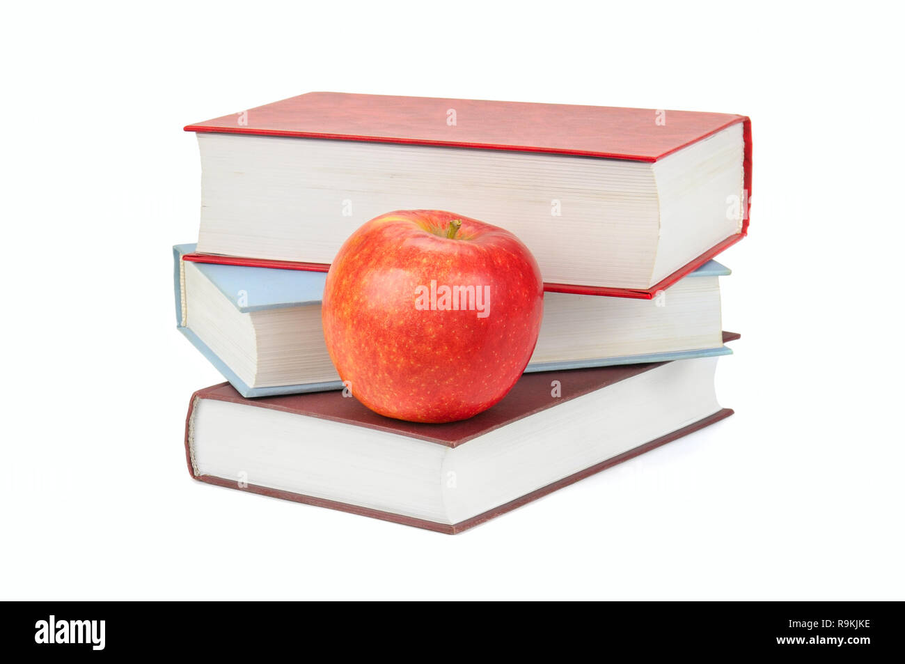 books and apple isolated on white background Stock Photo - Alamy