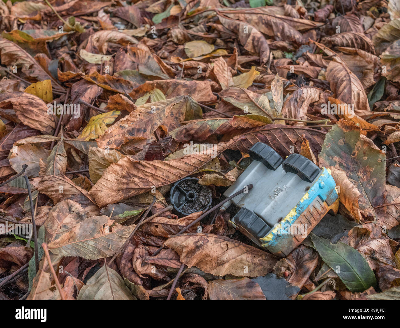 Plastic kid's broken toy car abandoned in rural woodland. Metaphor ...
