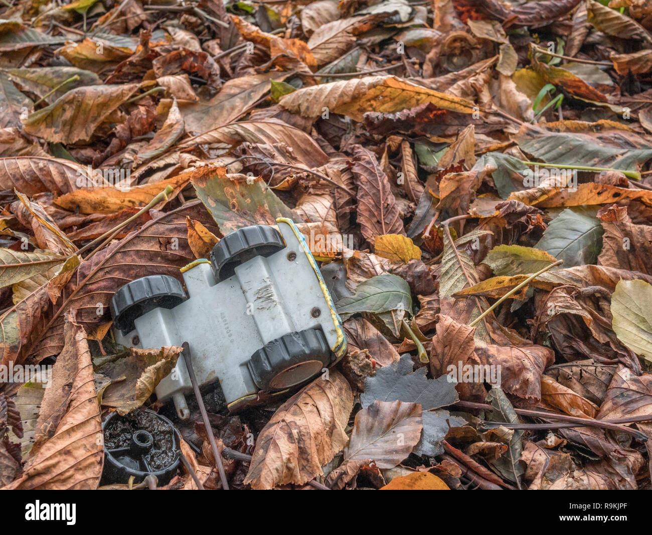 Plastic kid's broken toy car abandoned in rural woodland. Metaphor ...