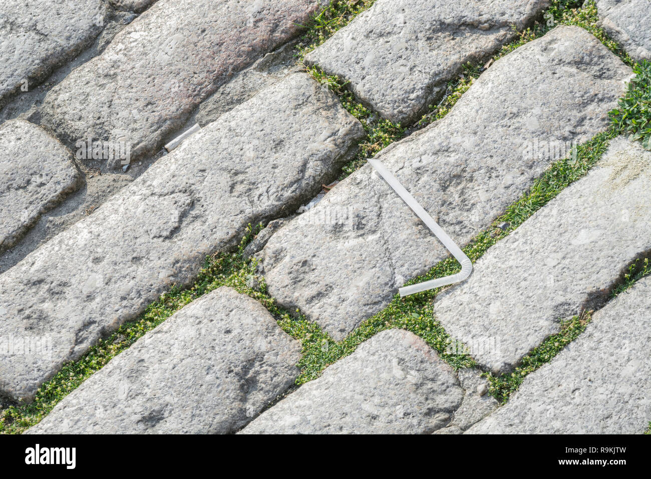 Plastic drinking straw discarded in Truro town centre. Metaphor plastic ...