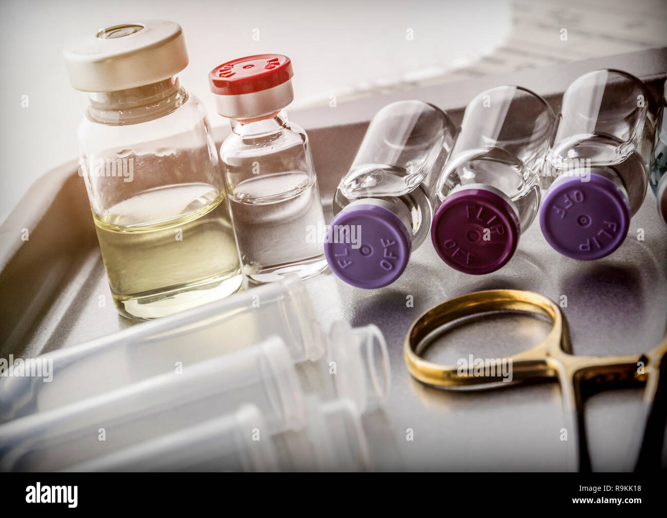 Scissors and vials in a table of operating room of a hospital ...