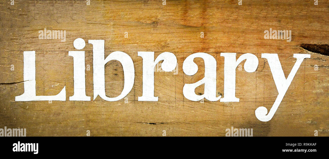 Library text sign on wood background for label Stock Photo - Alamy