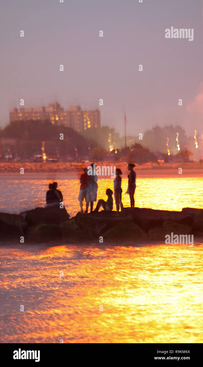 Silhouette group people during sunset hi-res stock photography and ...