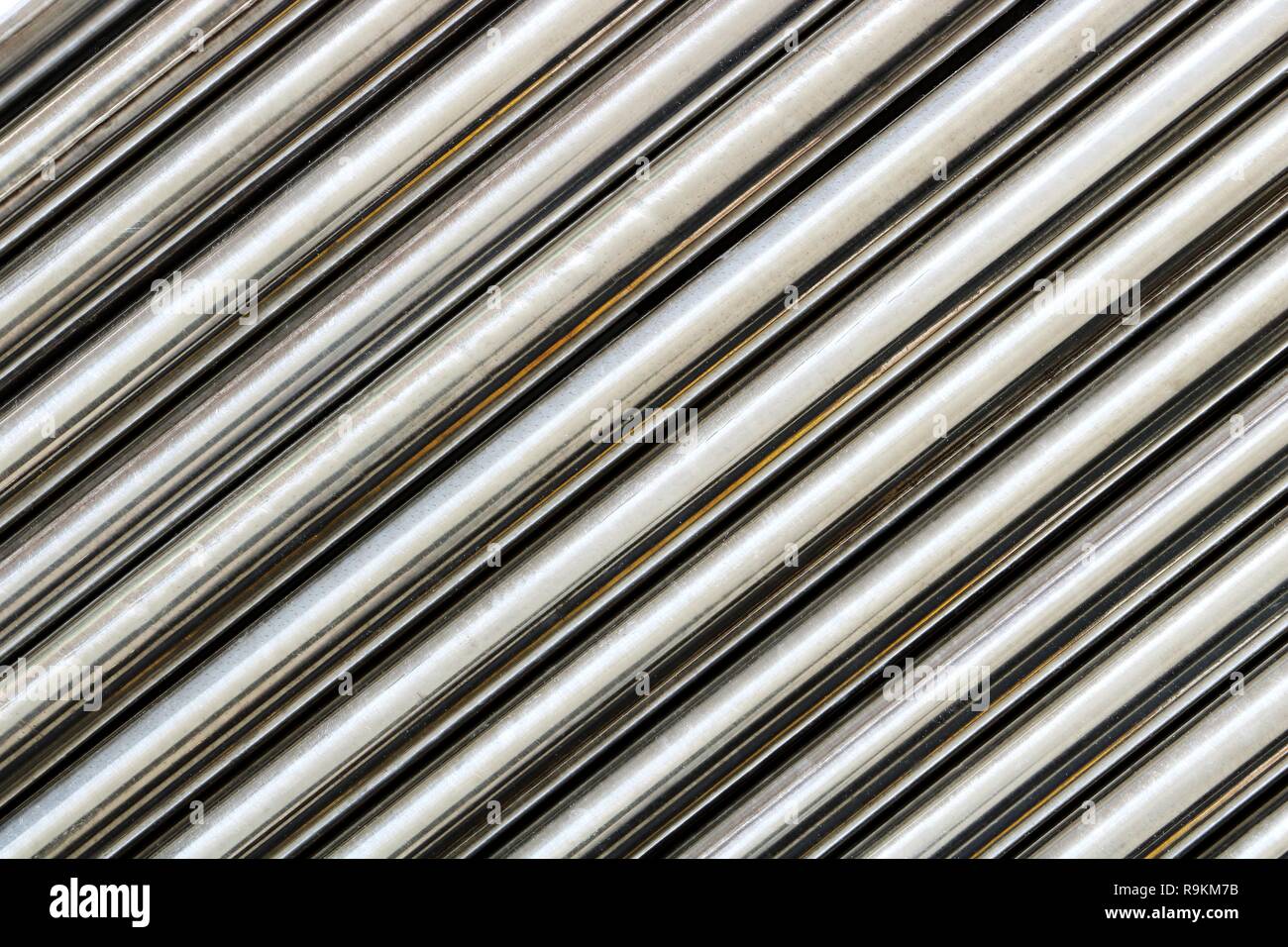 Texture of chrome steel pipe sort in diagonal, abstract background ...