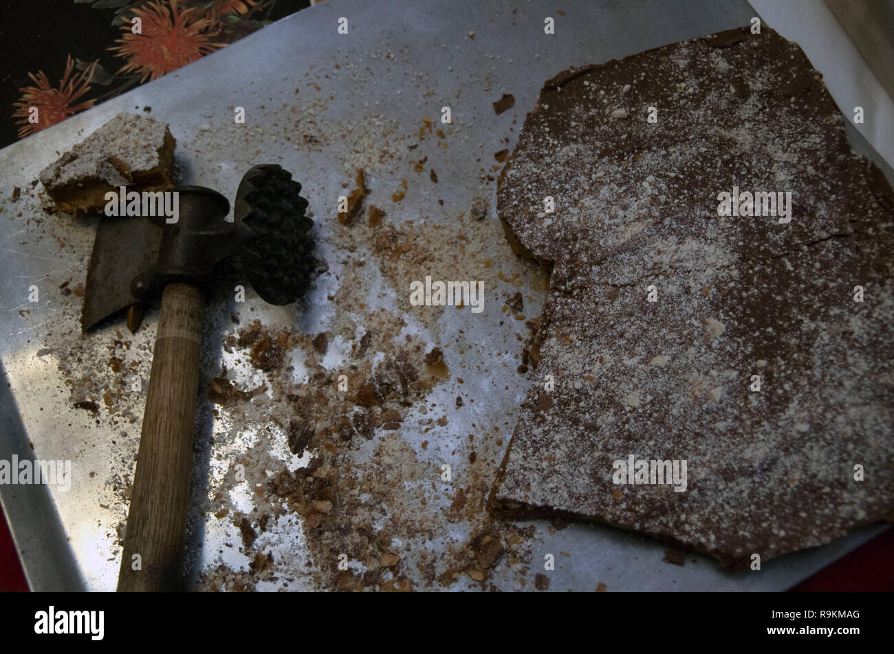 Toffee is a traditional Christmas candy. A hammer is used to break it ...