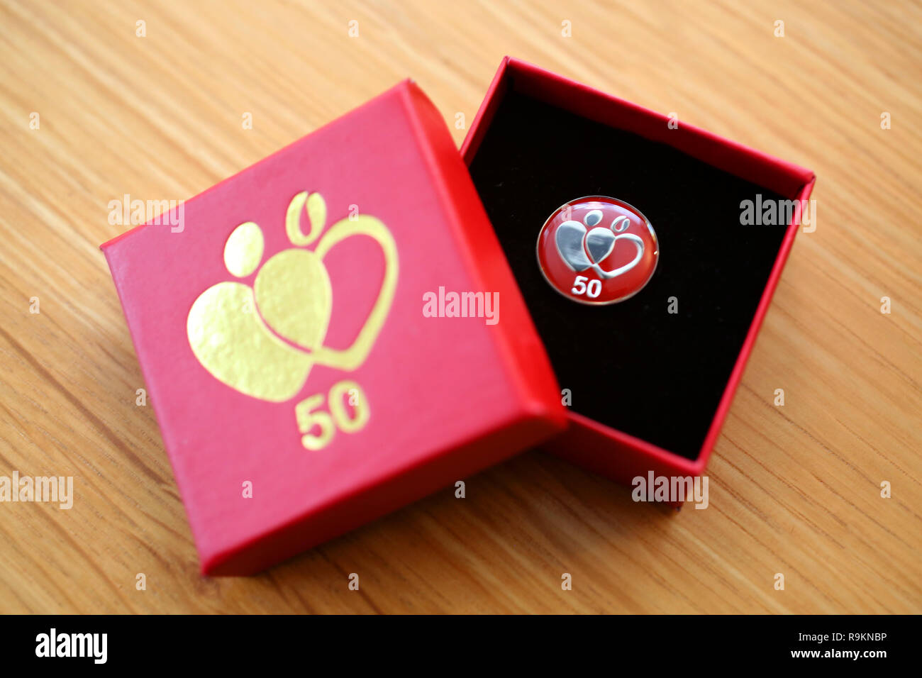 General views of a badge awarded for giving 50 pints of blood to the ...