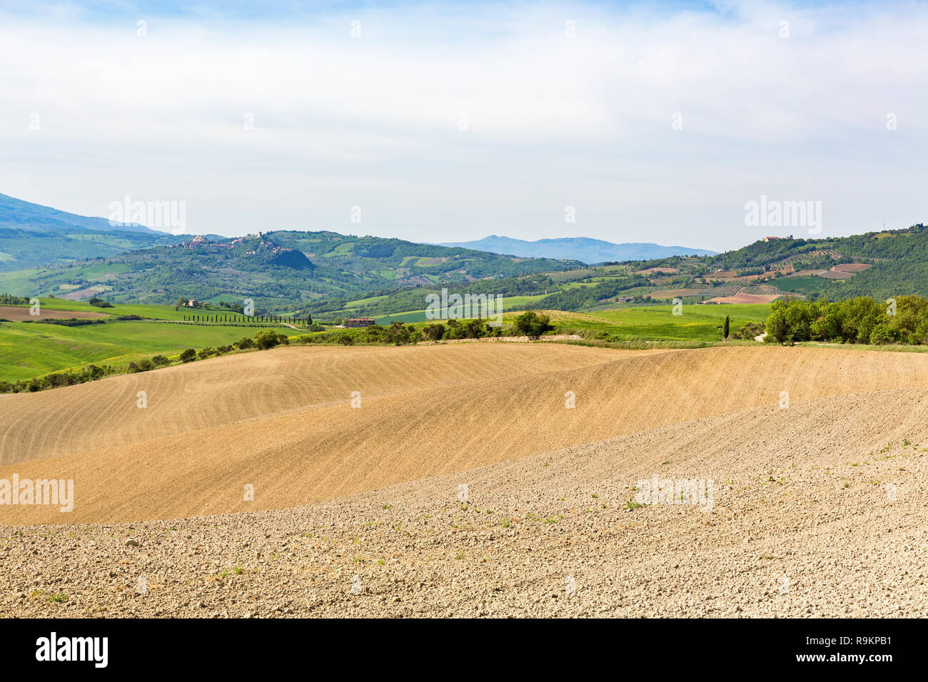 New sown field in a rolling landscape Stock Photo - Alamy