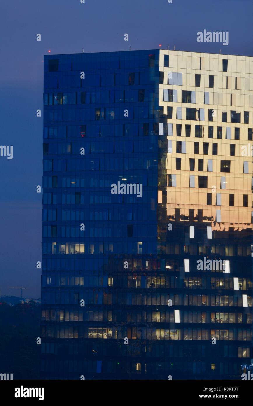 Sunrise reflections off modern, glass skyscraper buildings in upscale ...