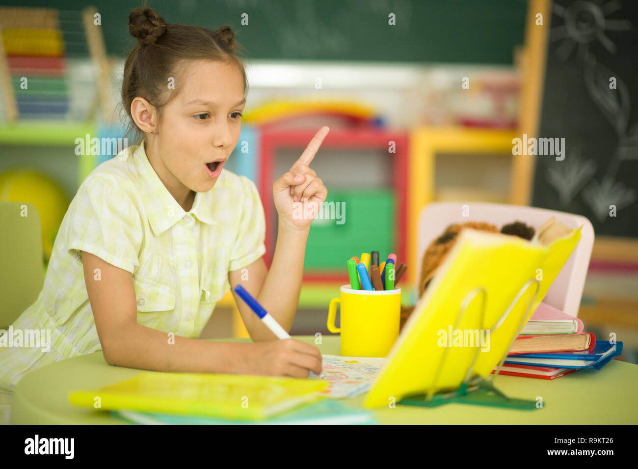Cute teen girl doing homework in her room Stock Photo - Alamy