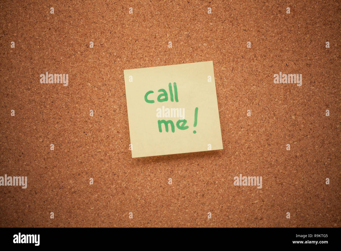 A call me sticky note on a cork board Stock Photo - Alamy