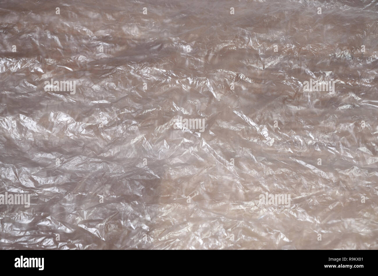 Texture of white crumpled cellophane surface transparent on sunlight ...