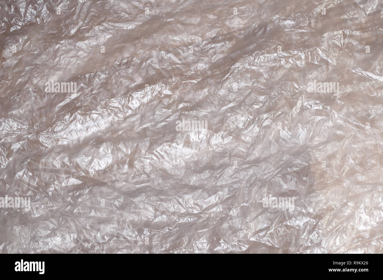 Texture of white crumpled cellophane surface transparent on sunlight ...