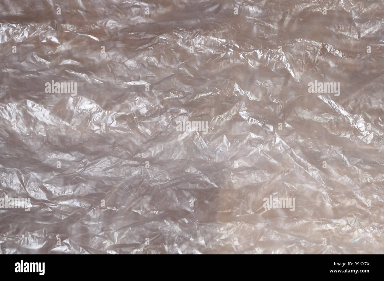 Texture of white crumpled cellophane surface transparent on sunlight ...