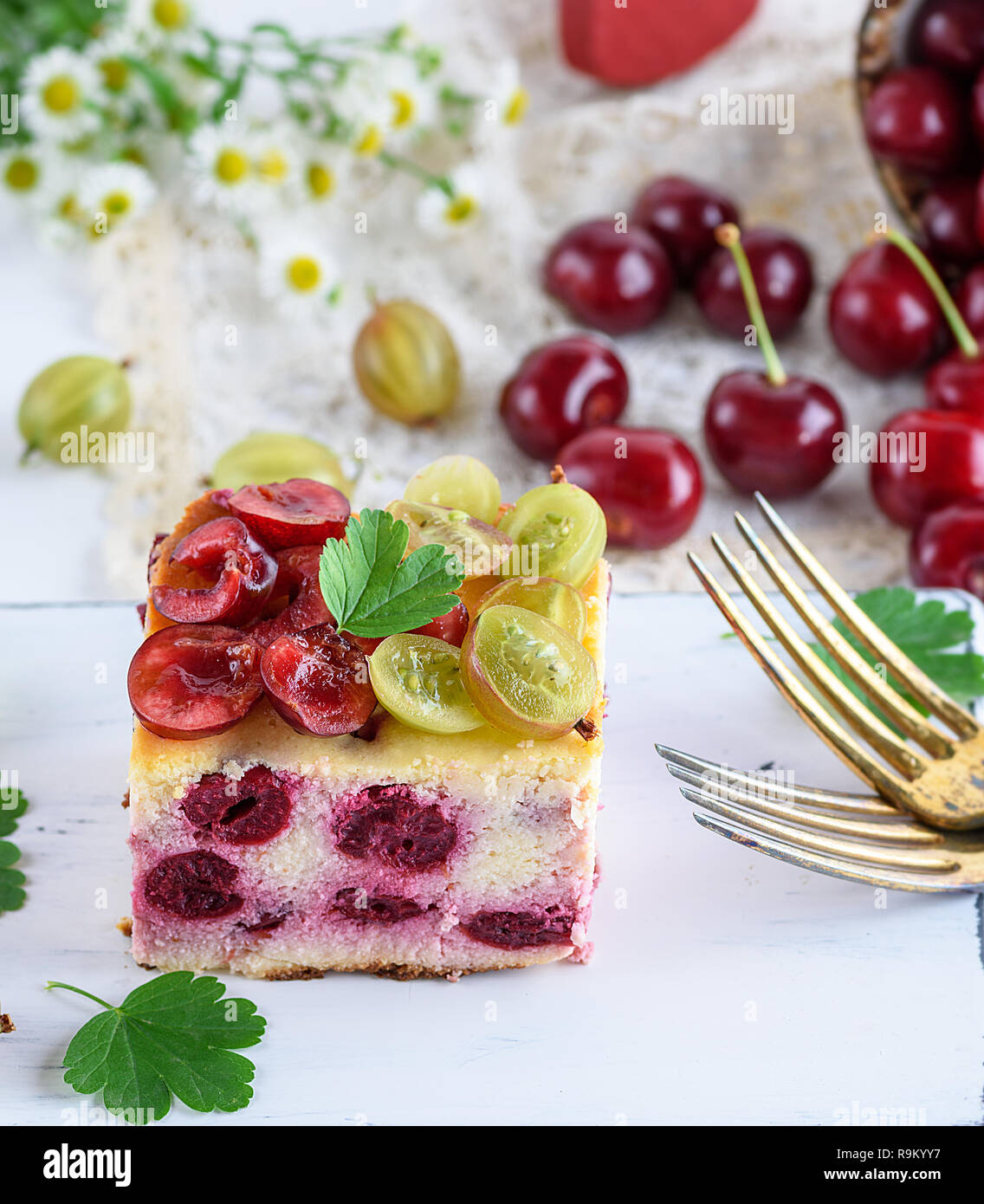 cheesecake with cherry berries and homemade cottage cheese, decorated ...
