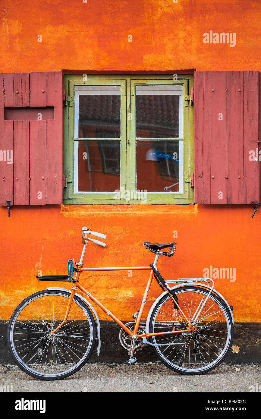 Orange wall and vintage bicycle windows in Copenhagen City Stock Photo ...