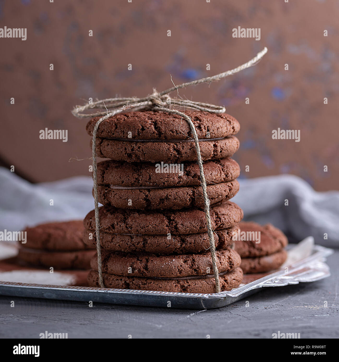 stack of round chocolate cookies tied with a rope Stock Photo - Alamy