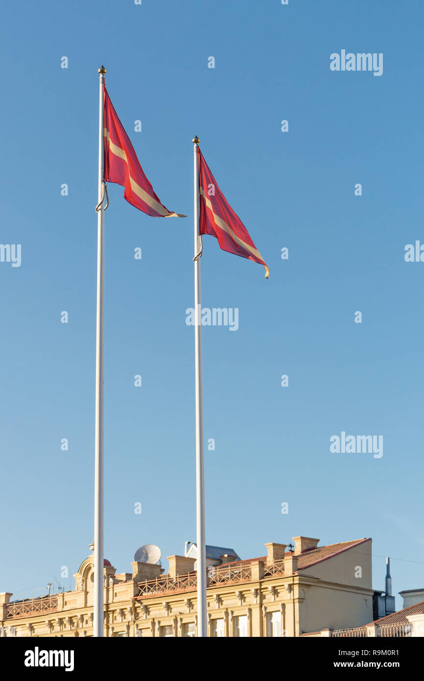 Two flags of the city of Vilnius against the background of a clear blue ...