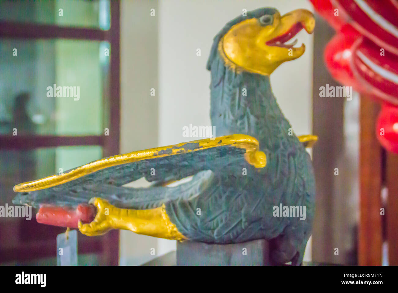 Head of Kalavinka sculpture in front of thai style battleship ...