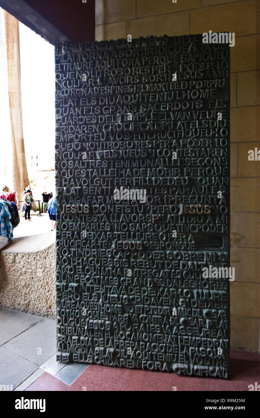 Carved words on the main wooden door of the Sagrada Familia designed by ...