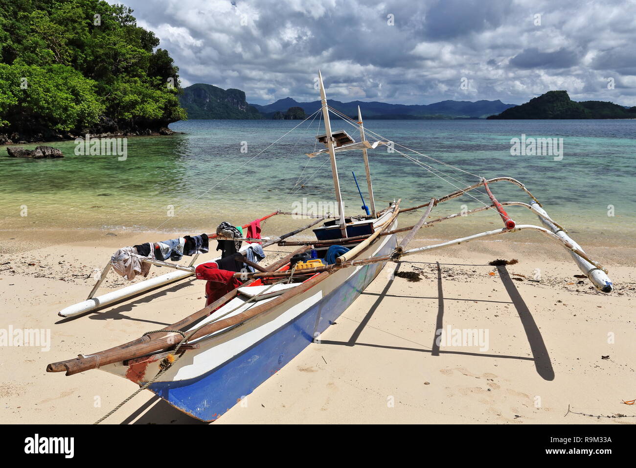 E-wards view from Cudugnon Point Cave beach over beached old Filipino ...