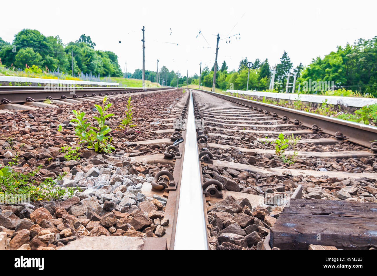 View on rails and sleepers of a two ways railroad in Lithuania Stock ...