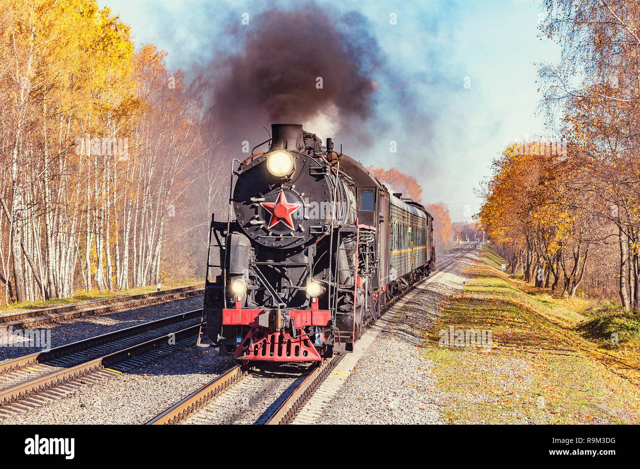 Steam train moves toward at autumn day time. Moscow central railway ...