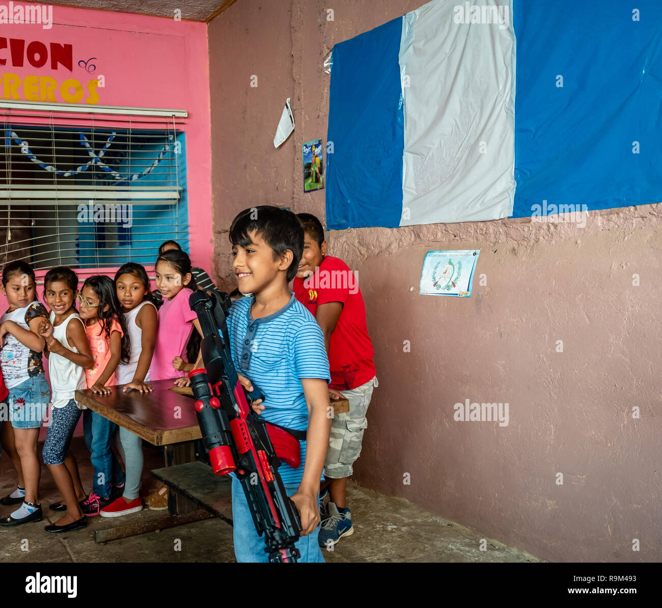 Guatemalan children with super hero in Guatemala Stock Photo - Alamy