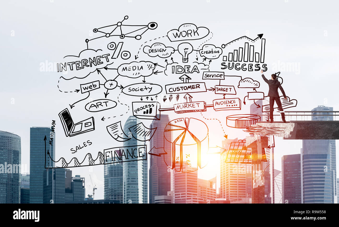 Businessman drawing business conceptual sketches Stock Photo - Alamy