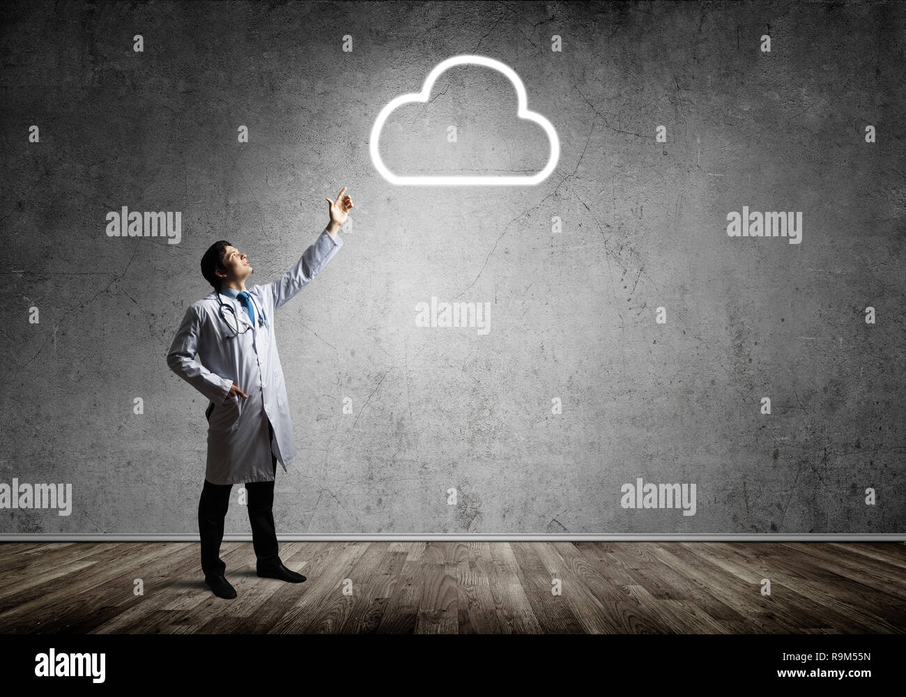 Conceptual image of doctor with cloud symbol Stock Photo - Alamy