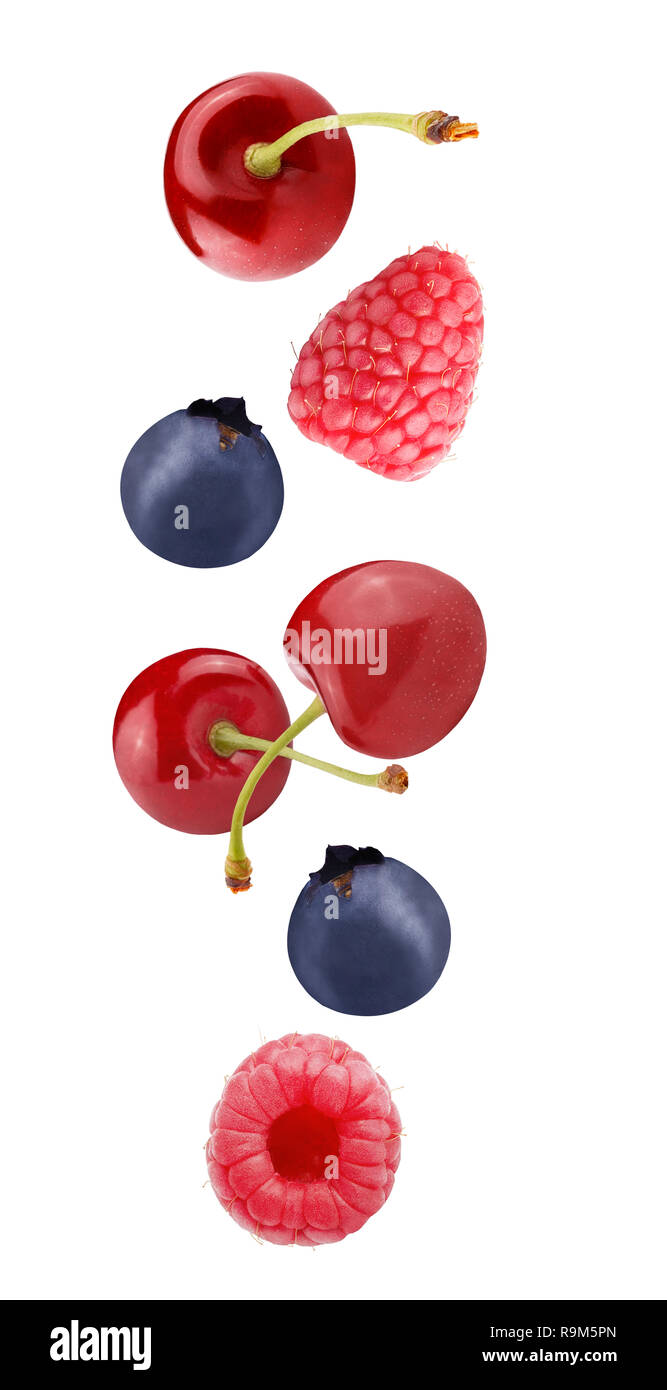 Isolated falling fruits. Flying cherry, raspberry and blueberry ...