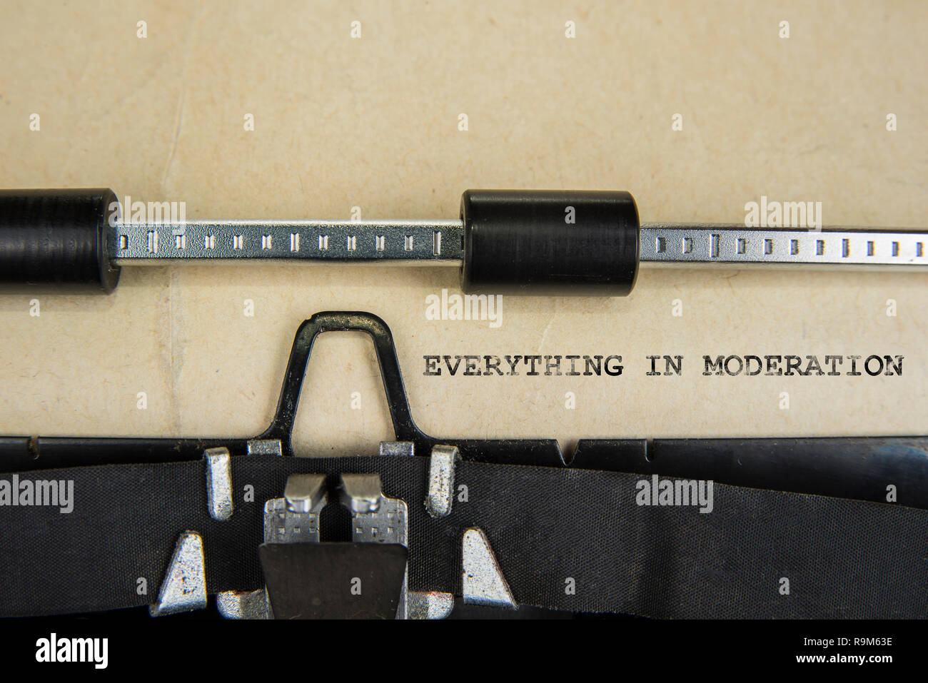 Motivation sign Everything in Moderation written on old typewriter ...
