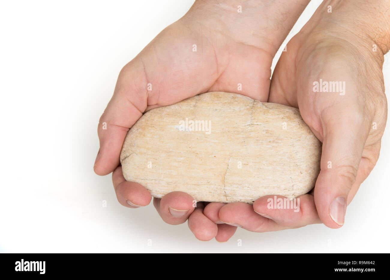 Pebble stone in hands. Concept for a faith and spirituality Stock Photo ...