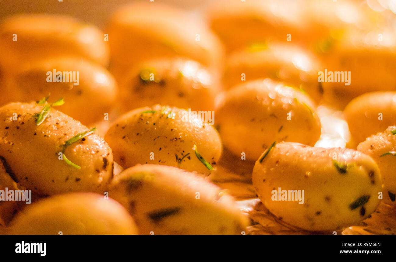 rustic food and homemade cooking styled concept - roasted potatoes in ...