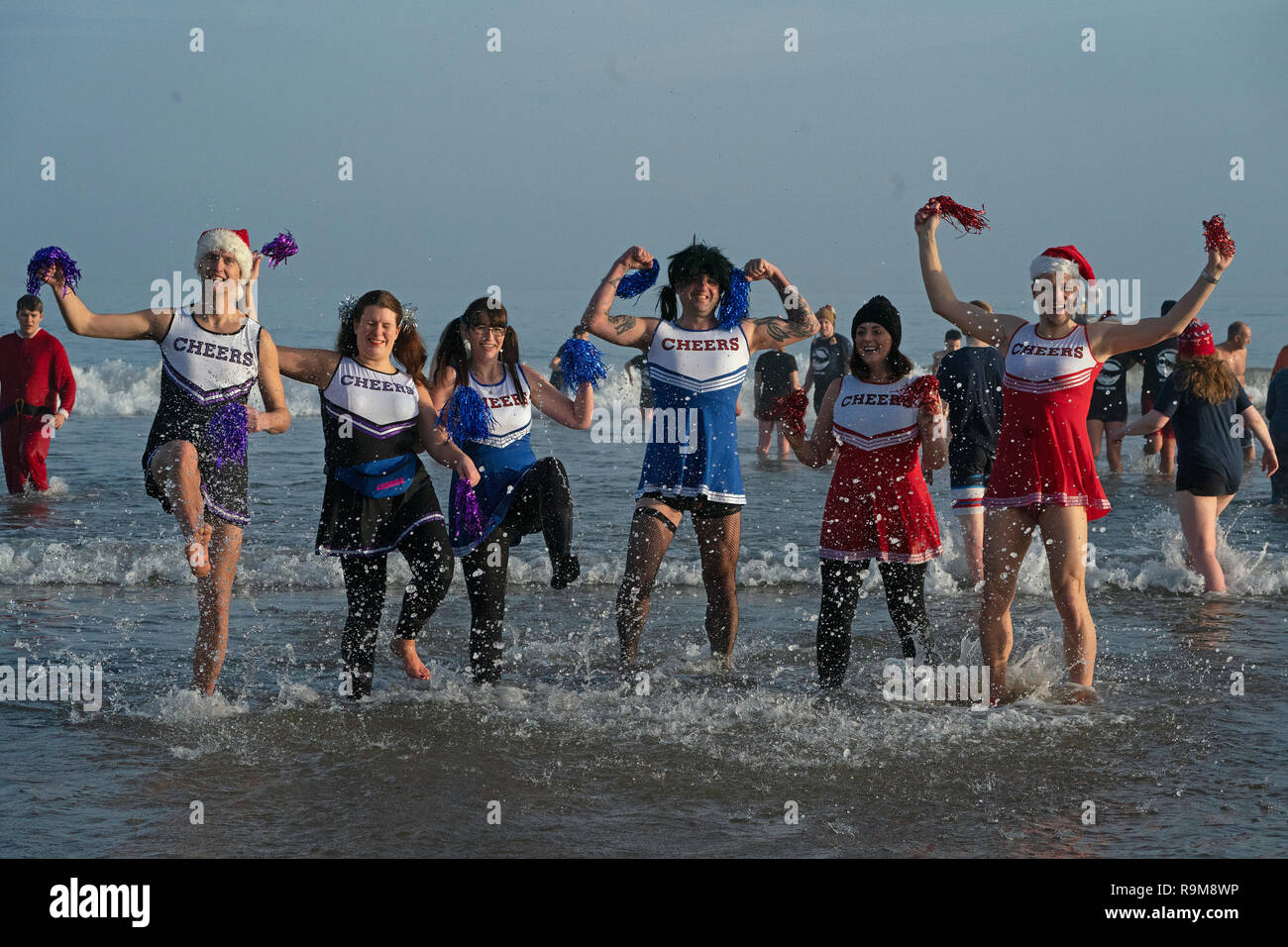 Revellers in cheerleader costumes take part in the traditional Boxing ...