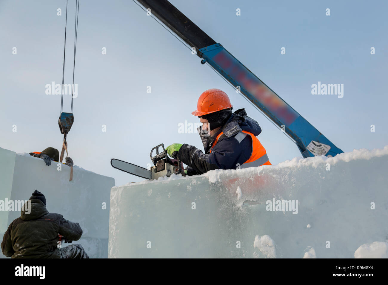 Installers are building an ice town of ice blocks Stock Photo - Alamy