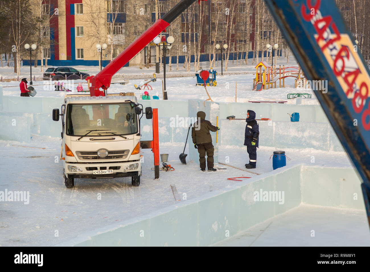 Installers are building an ice town of ice blocks Stock Photo - Alamy