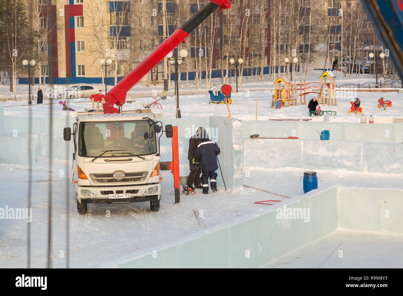 Installers are building an ice town of ice blocks Stock Photo - Alamy