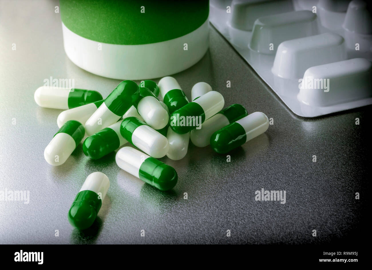 Small green capsules hi-res stock photography and images - Alamy