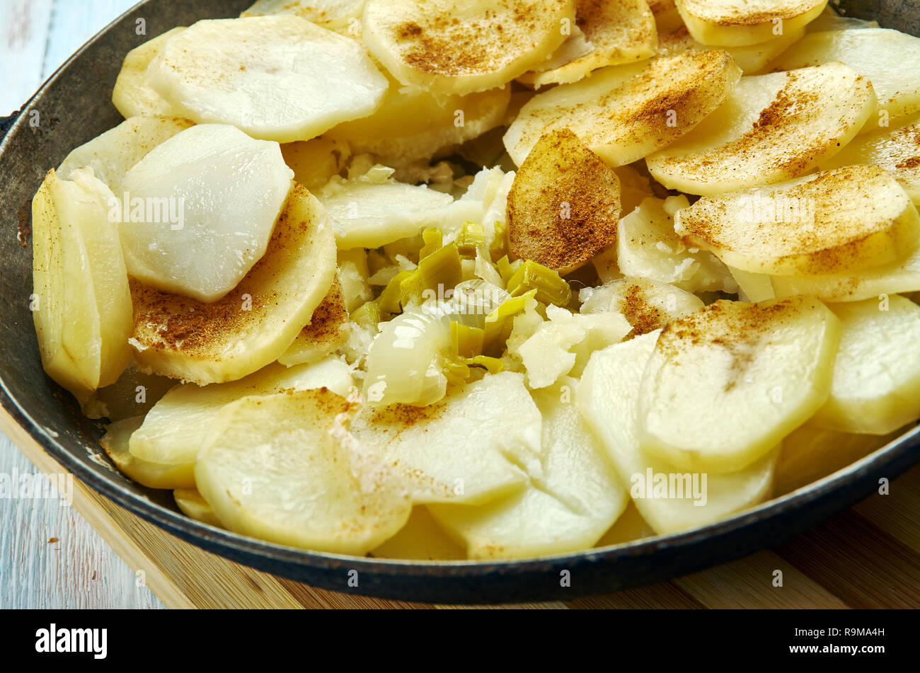 Welsh onion cake, layers of sliced potatoes and soft onions cooked ...